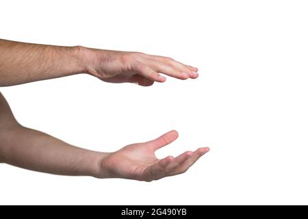 Hand of man pretending to hold an invisible object against grey ...
