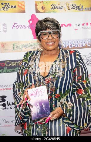 Lancaster, USA. 19th June, 2021. Founder/Owner Susan Jackson cutting ...