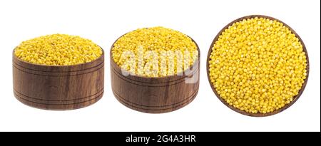 Millet in wooden bowl, isolated on white background. Unpeeled millet ...