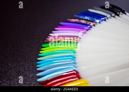 Samples of colorful fake nails on a white surface Stock Photo - Alamy