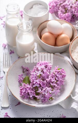 Sweet fried lilac flower with powdered sugar. Summer dessert. Lilac ...