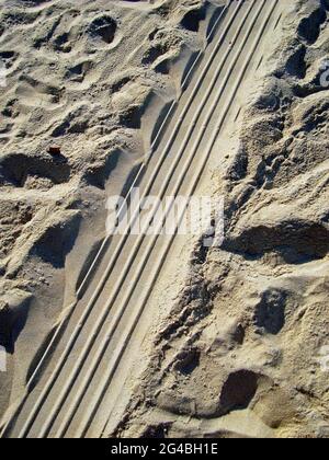 car tracks sand tropical beach grass land clear sky Stock Photo - Alamy