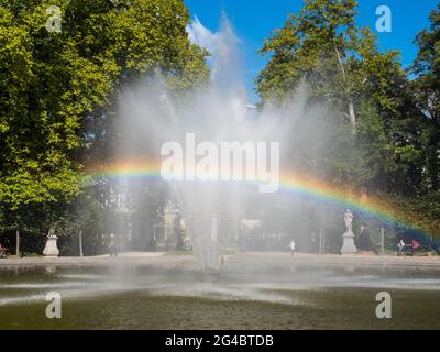 Artificial fountain with reflected bubble water rainbow in natural park ...