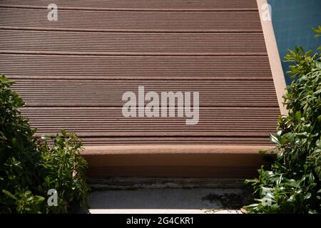 Composite Deck covered bridge over swimming pool Stock Photo - Alamy