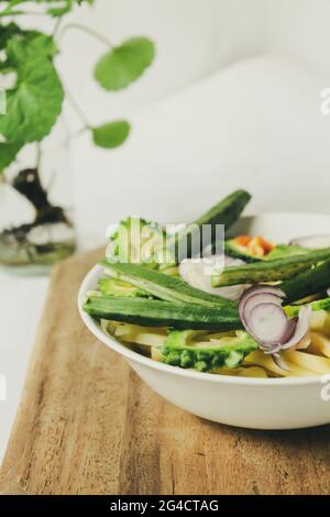 Bowl with mix of frozen vegetables on white background Stock Photo - Alamy