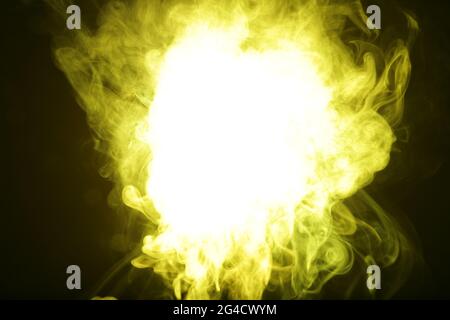Artificial yellow light illuminates smoke on dark background Stock ...