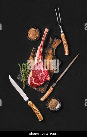 Preparation of tomahawk steak (view from above Stock Photo - Alamy