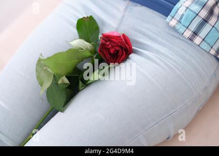 Woman has withered rose in crotch between legs Stock Photo - Alamy