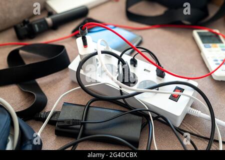 Electrical power strip overloaded with many plugs Stock Photo - Alamy