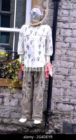 A dummy man hangs with a noose round the neck in Tideswell, Derbyshire ...