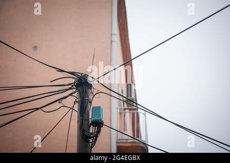 Picture of a messy power line connection with a lot of cables going ...