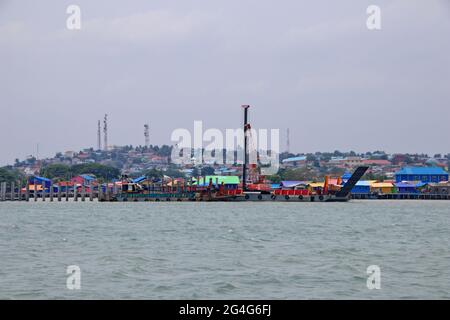 BATAM, INDONESIA - Aug 06, 2019: Large Cargo Barge is on the beach dock ...