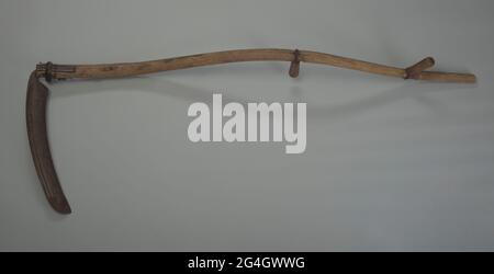 A steel scythe with a wood handle owned by George Madison. The scythe ...