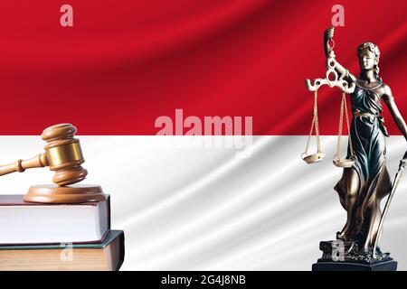 Monaco flag with statue of lady justice and judicial scales in dark room. Concept of judgement ...