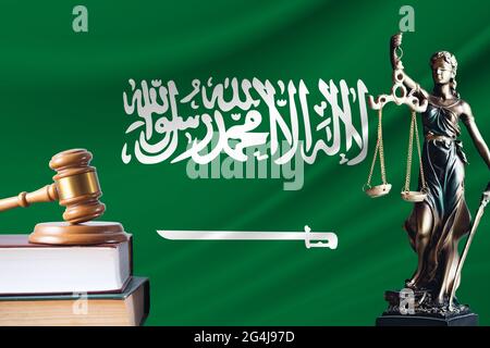 Saudi Arabia flag with statue of lady justice and judicial scales in ...
