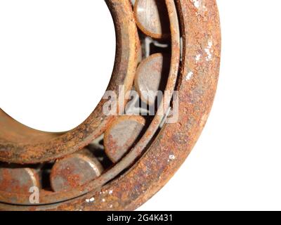 Closeup shot of a stuck rusty ball bearing isolated on a white ...