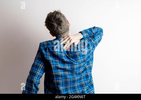 Young male feeling a painful backache on a white background Stock Photo ...