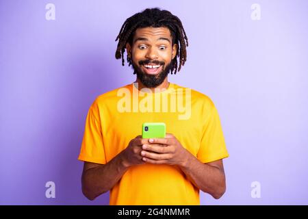 Portrait of nice impressed brunette hairdo girl hand cheek wear yellow ...