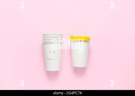Takeaway cups for coffee with drawn smile on color background Stock ...