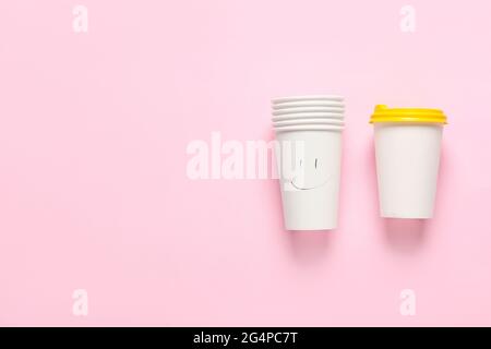 Takeaway cups for coffee with drawn smile on color background Stock ...