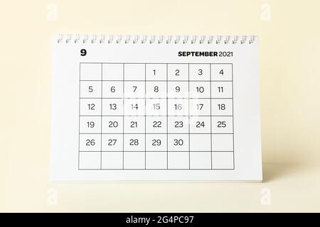 Flip calendar with page of September on color background Stock Photo ...