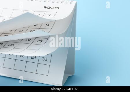 Flip calendar with page of July on color background, closeup Stock ...