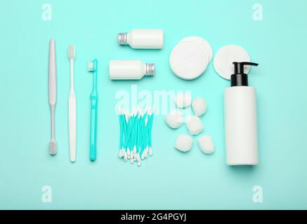 Composition with cotton swabs, balls, pads and toothbrushes on color ...
