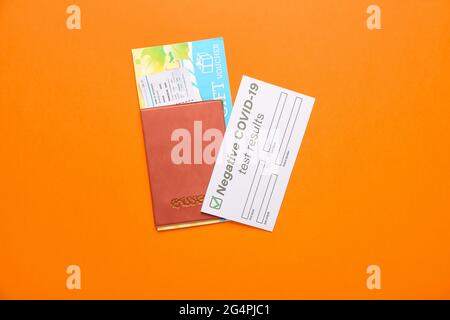 Passport, ticket, travel voucher, covid-19 test result and vaccine on ...