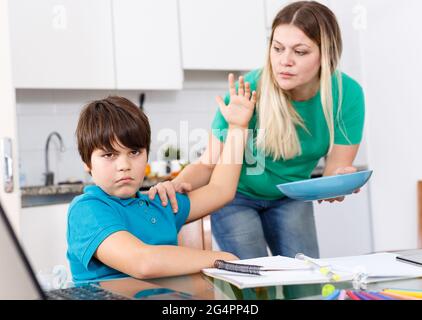 Displeased boy refusing to eat Stock Photo - Alamy