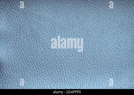 Genuine leather, artificially dyed in pale pink, close-up. Background ...