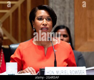 District of Columbia Mayor Muriel Bowser leaves after casting her vote ...