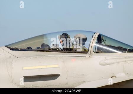 Jet fighter pilot wearing helmet with respirator and visor of the ...