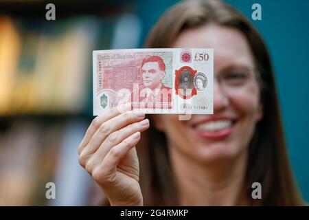Sarah John, chief cashier of the Bank of England, with a new 50-pound ...