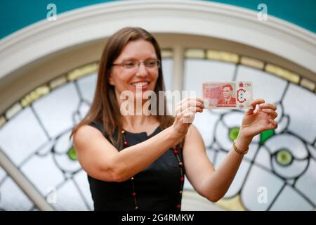 Sarah John, chief cashier of the Bank of England, with a new 50-pound ...