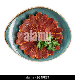 Isolated plate of dried beef tenderloin basturma Stock Photo - Alamy