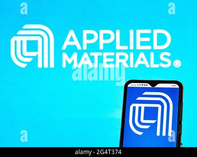 In this photo illustration an Applied Materials logo seen displayed on ...