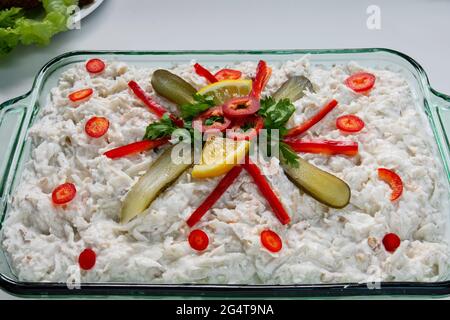Prepairing Celery salad. Celery salad with yogurt garnished with ...