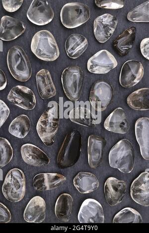 Smoky quartz rare jewel stones texture on black background Stock Photo ...