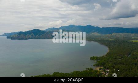 Lake Lanao and mountain with green forest. Blue sky and clouds ...