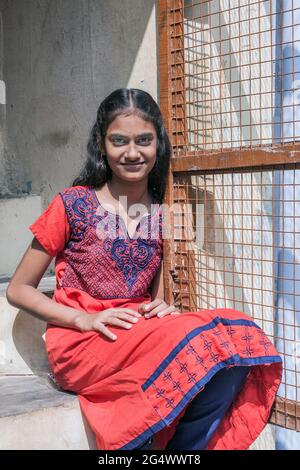 Photo of pretty adorable dark skin lady wear casual sweater smiling ...