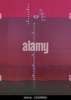 Close up of draft markings and waterline on side of container or cargo ...