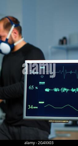 Team of medial researchers monitoring vo2 of woman performance sports ...
