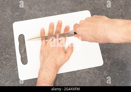 Cutting the fingers with knife - Preparation - Isolated on white Stock ...