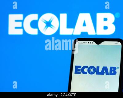 In this photo illustration, the Ecolab logo is seen displayed on a ...