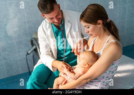 Pediatrician doctor examines baby. Healthcare, people, examination ...