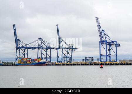 London Thamesport dock cranes on the River Medway across the Thames ...