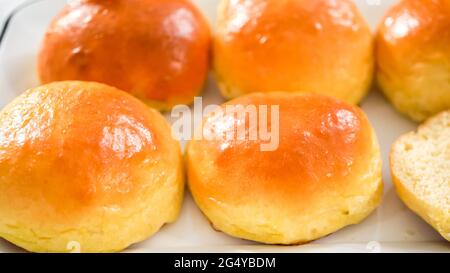 Step by step. Freshly baked brioche buns on a metal serving tray Stock ...