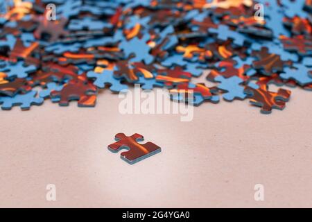 Colorful Peaces of a Mixed Jigsaw Puzzle Lie on the Wooden Table ...