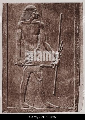 Ancient Egyptian stone panel with relief carving of man being thrown ...