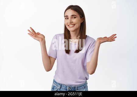 Oops sorry my mistake. Cute awkward woman shrugging shoulders and ...